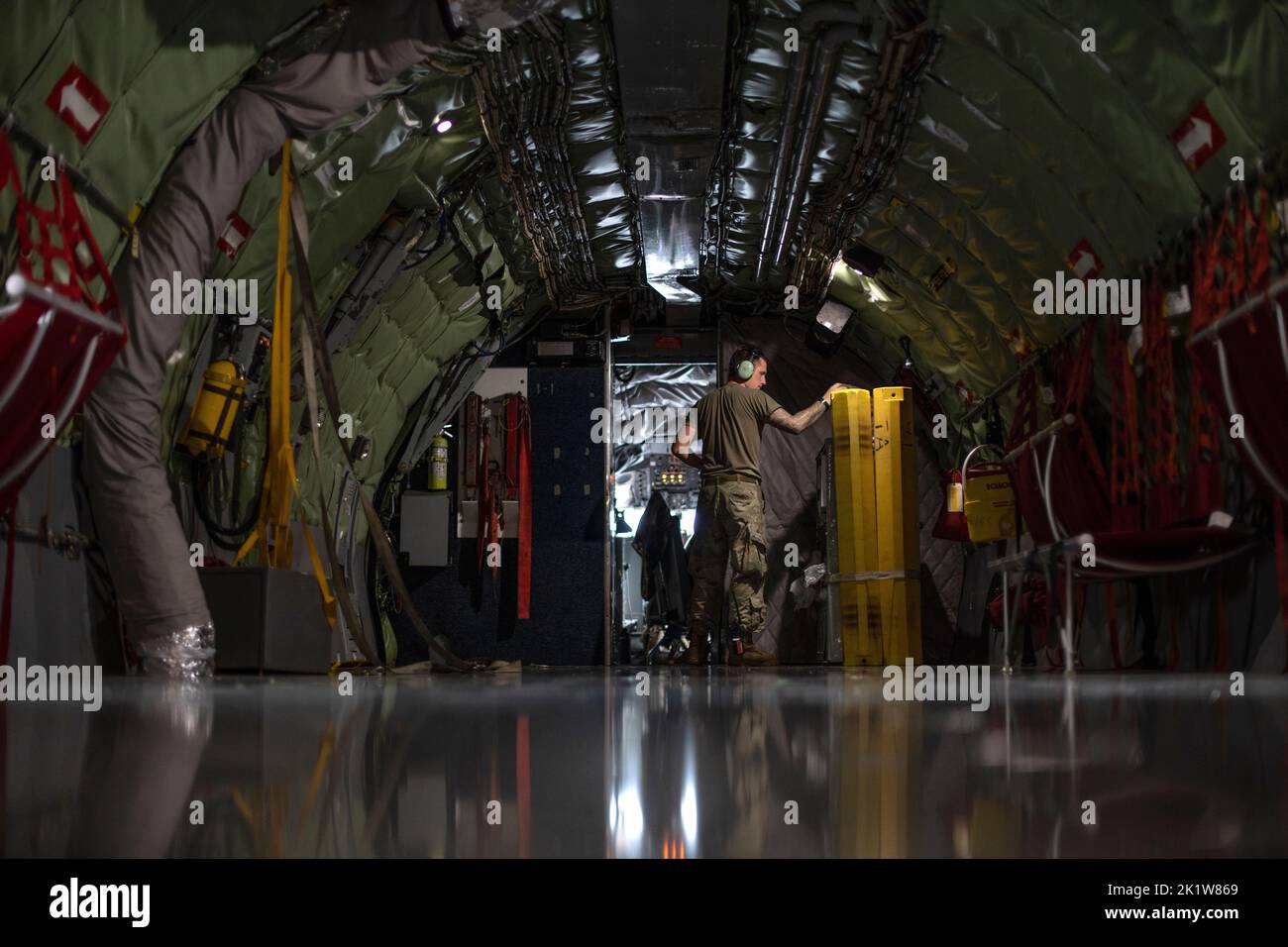 A crew chief assigned to the 718th Aircraft Maintenance Squadron stows ...