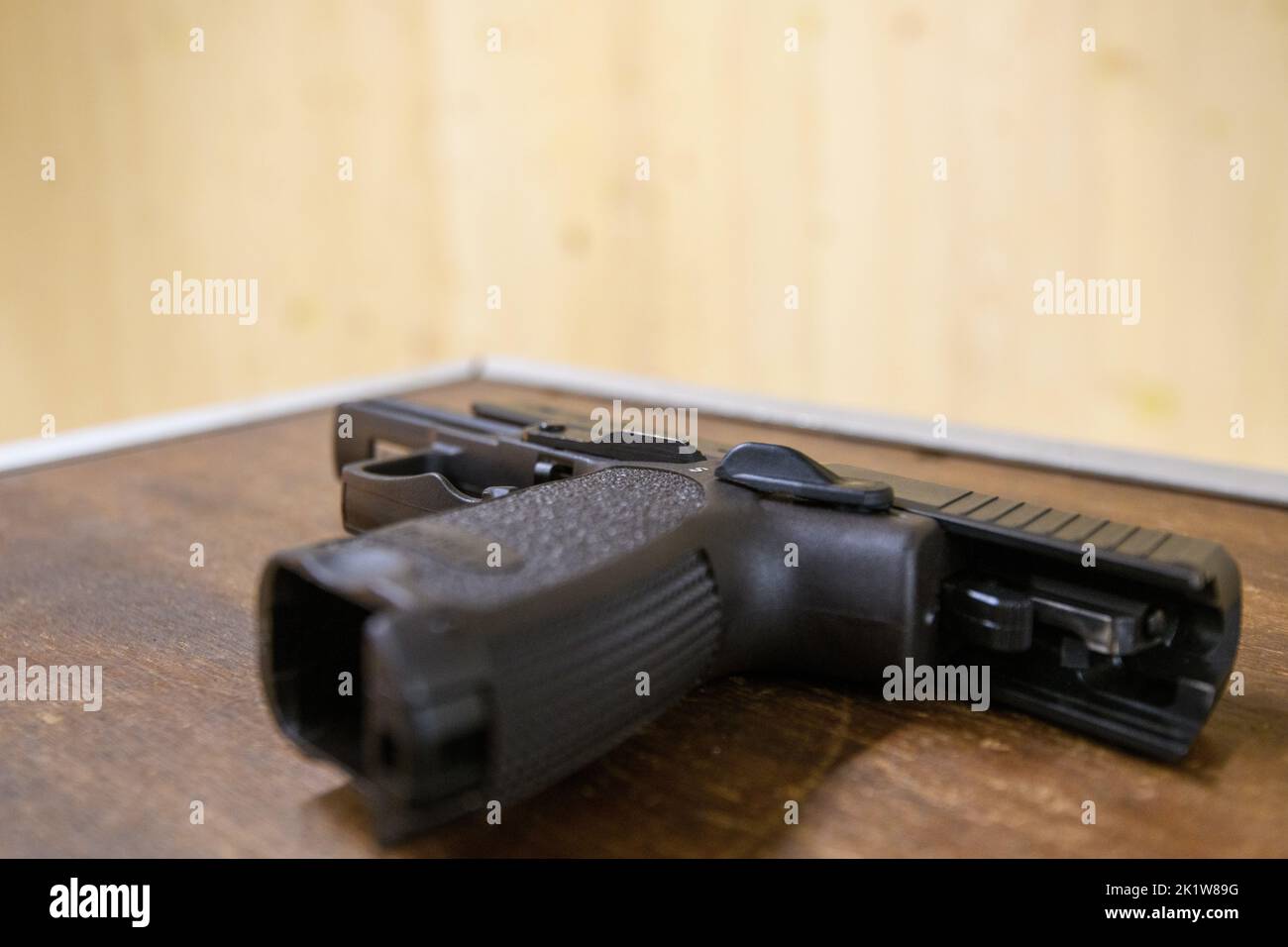 A Heckler and Koch P8 pistol lays on a table as U.S. Soldiers compete ...
