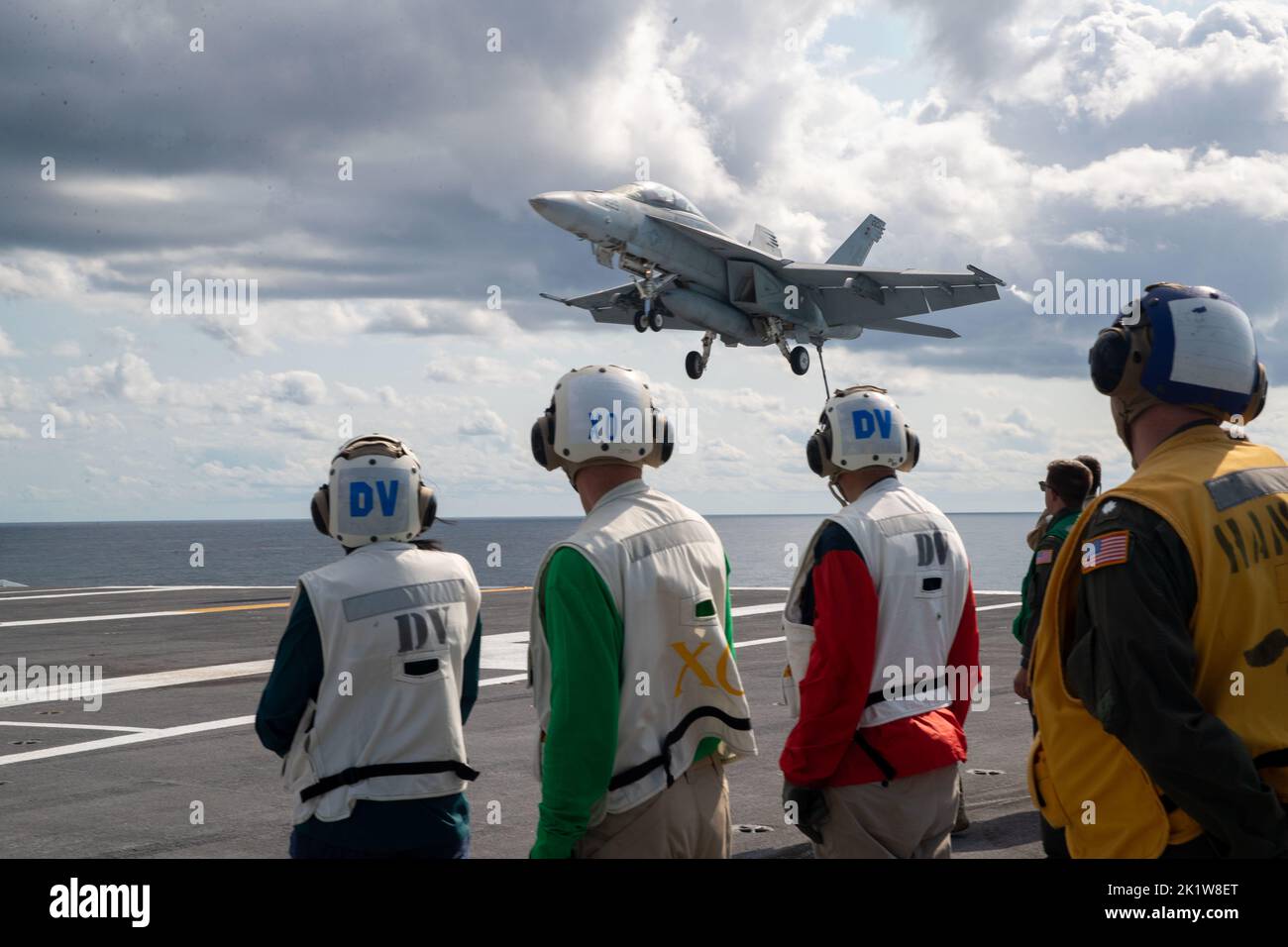 Capt. Jeremy Shamblee, center, the first-in class aircraft carrier USS ...