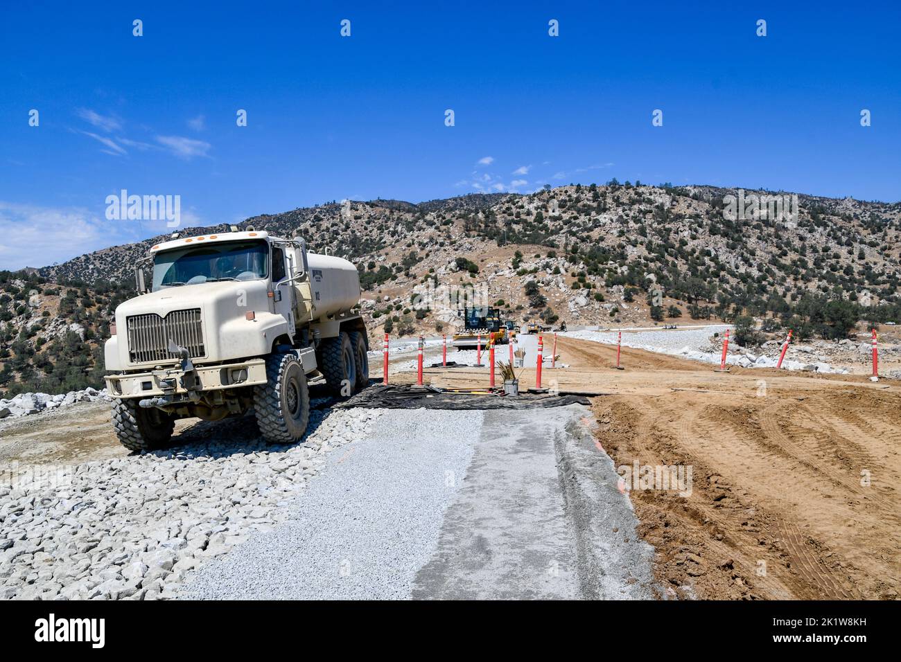Heavy equipment sits atop the main dam at the Isabella Dam Safety ...