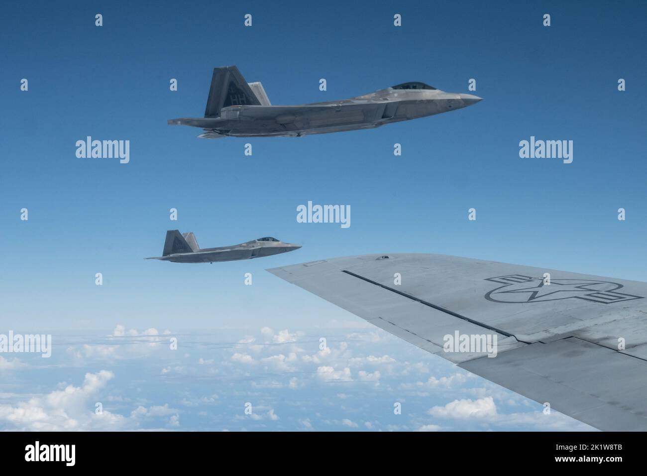 The inbound and outbound commanders of the 154th Wing fly F-22 Raptors ...