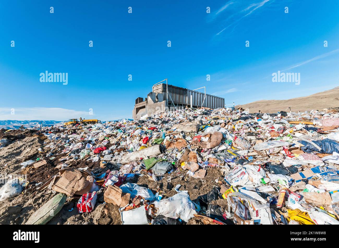 A semitrailer trailer is in a landfill tipper waiting to be dumped out ...