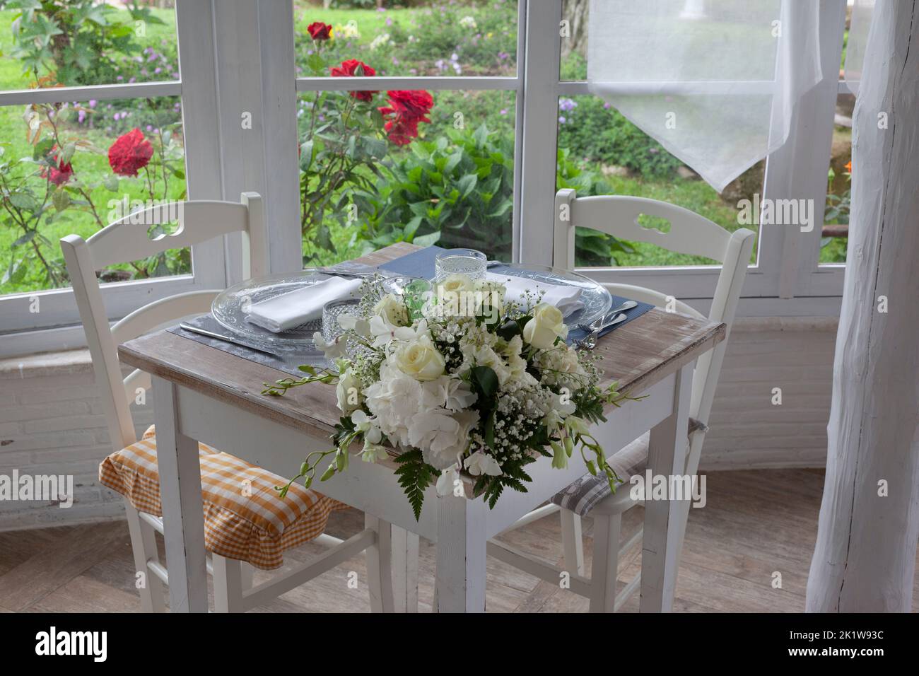 lunch set table in a bay window Stock Photo - Alamy