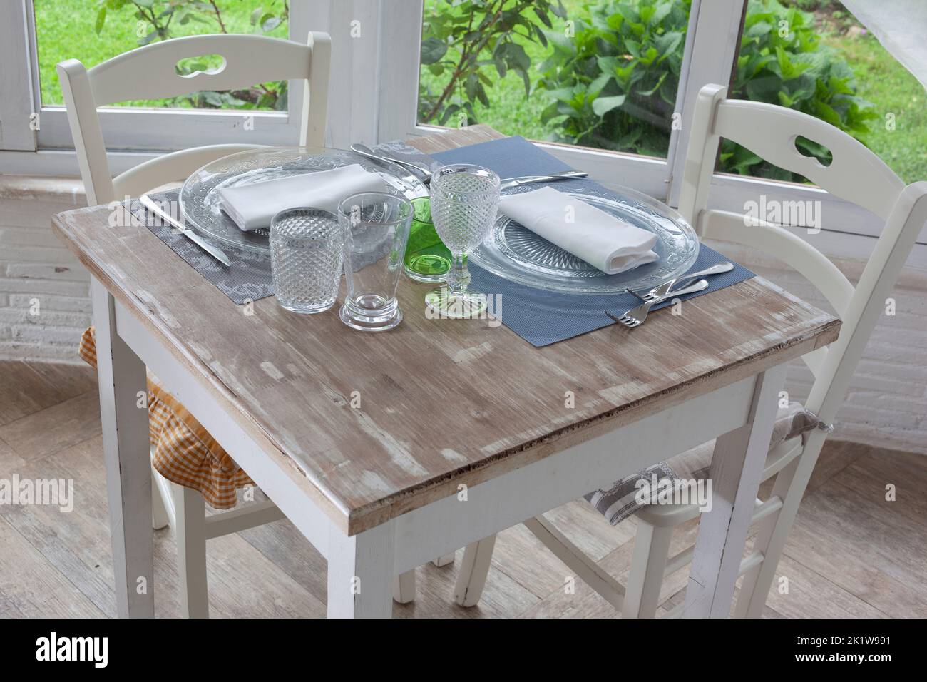lunch set table in a bay window Stock Photo - Alamy