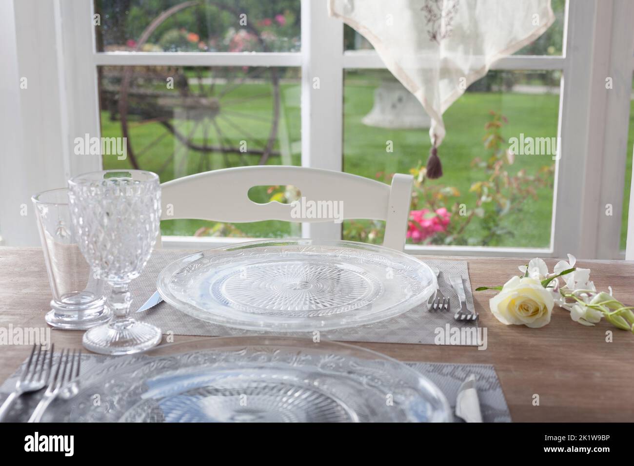 lunch set table in a bay window Stock Photo - Alamy