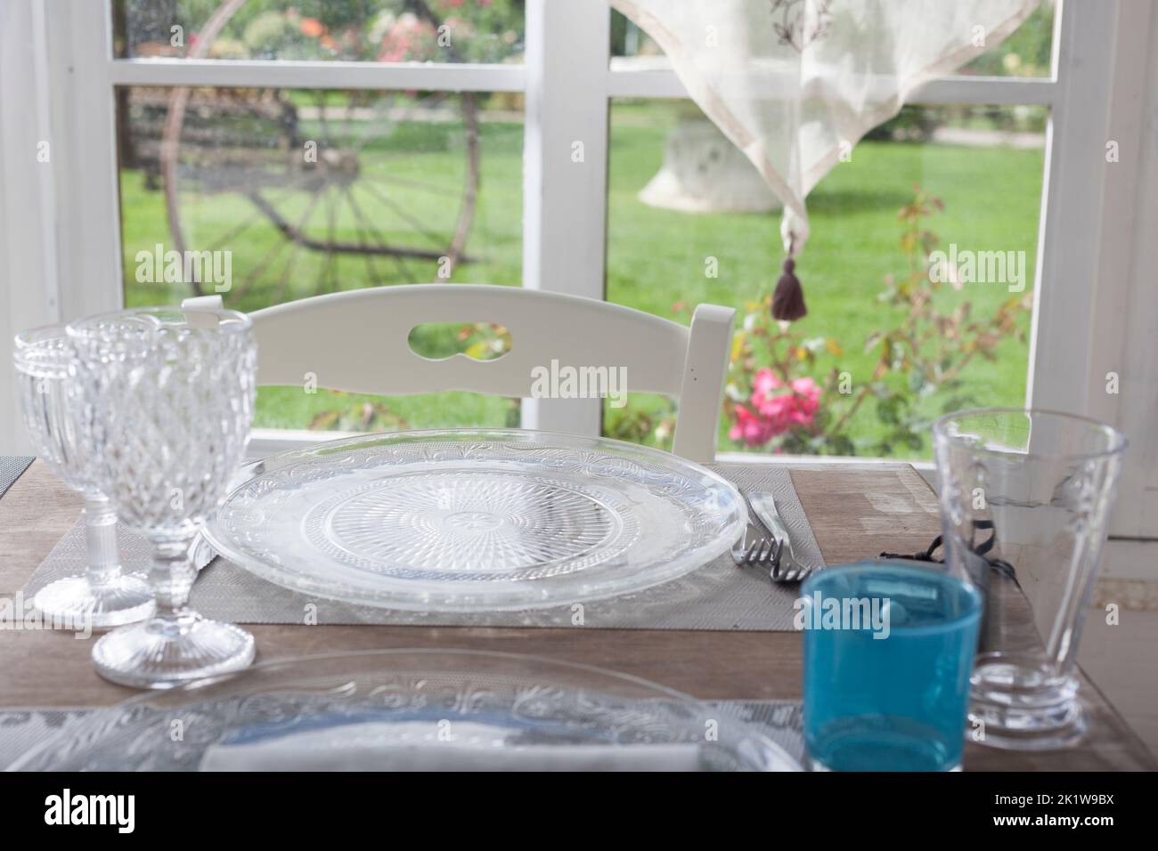 lunch set table in a bay window Stock Photo - Alamy