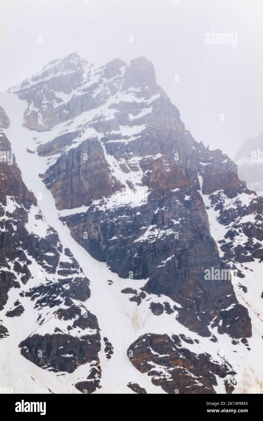 Cloud enshrouded mountains above Morraine Lake; Banff National Park ...