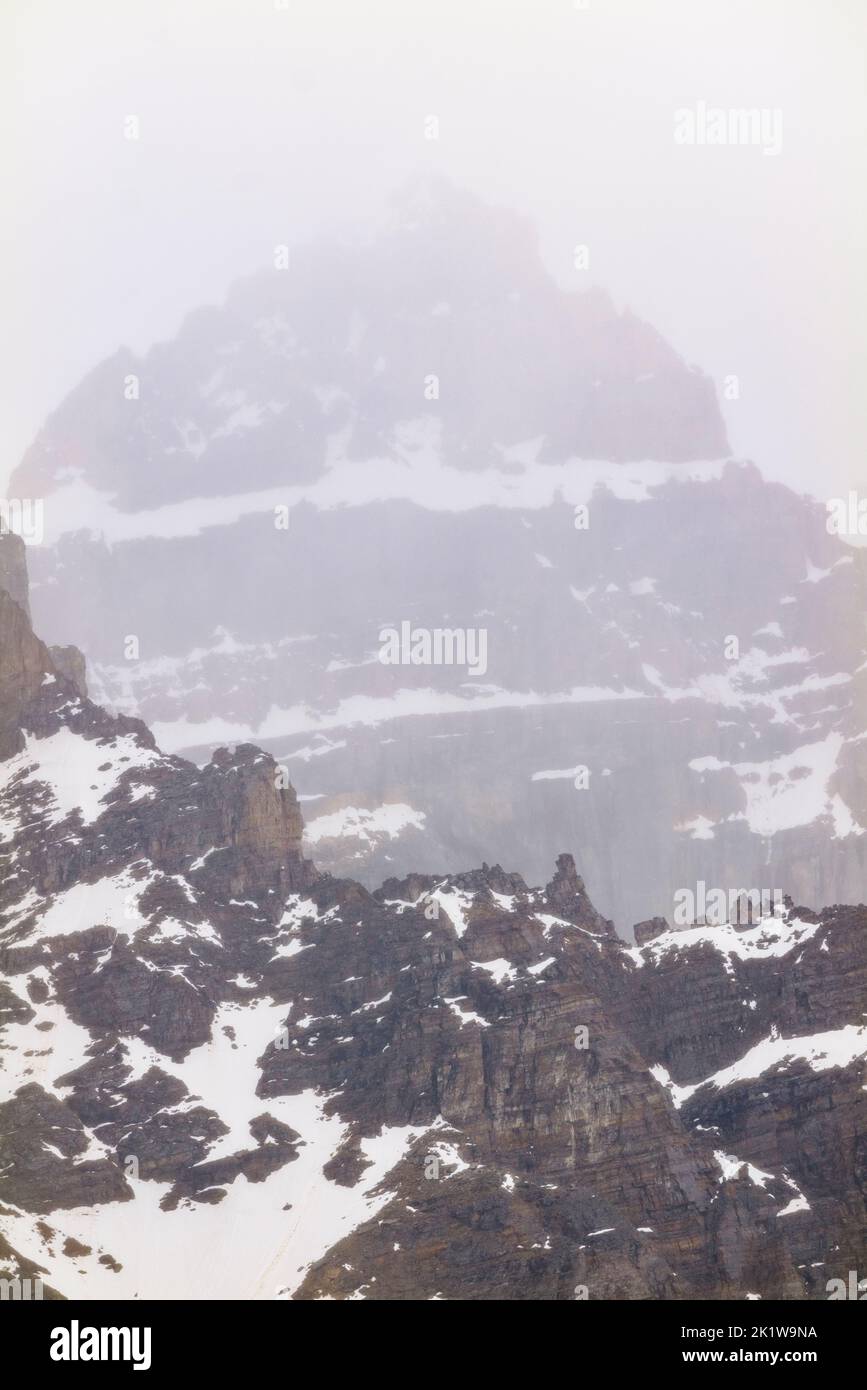 Cloud enshrouded mountains above Morraine Lake; Banff National Park ...