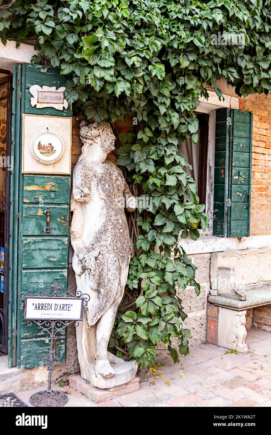 Female statue outside of shop inTorcello, one of the oldest Venetian ...