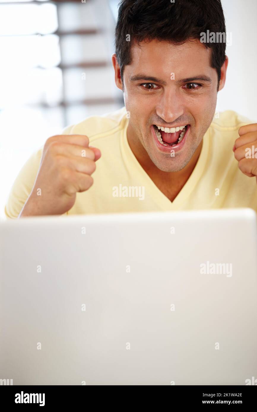 My teams back on the log. a handsome young man looking down at his ...