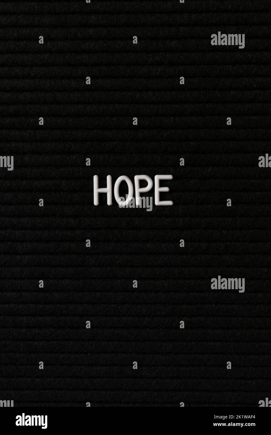 A vertical background about hope with plain white text on a black ...