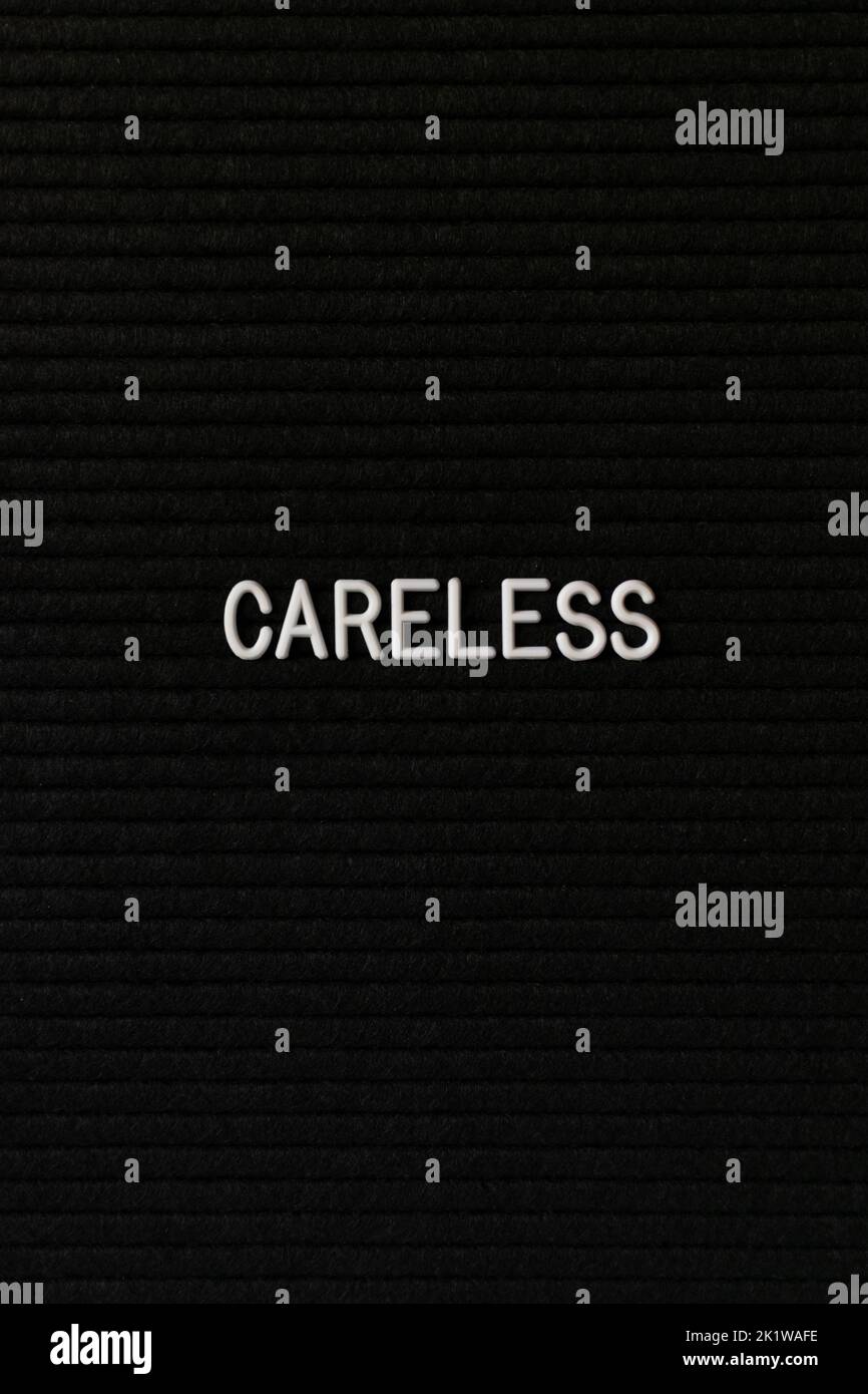 A depressing vertical background saying careless in white text over a ...