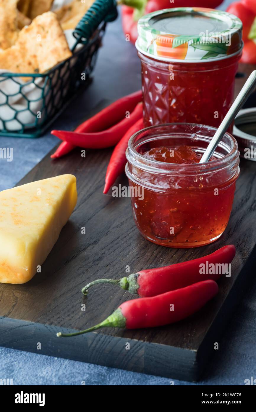 Jars of delicious homemade hot chili pepper jelly with cheese and ...