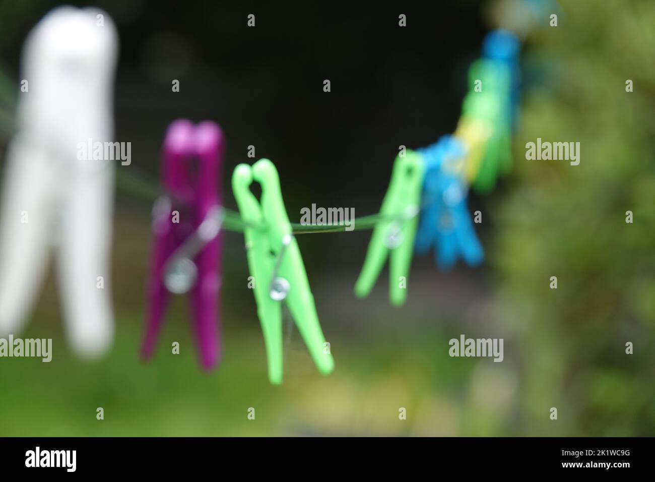 Pegs on clothesline Stock Photo - Alamy