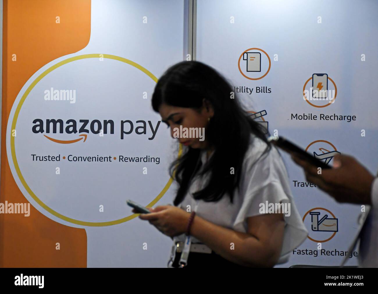 Mumbai, India. 20th Sep, 2022. A woman uses her mobile phone near the ...