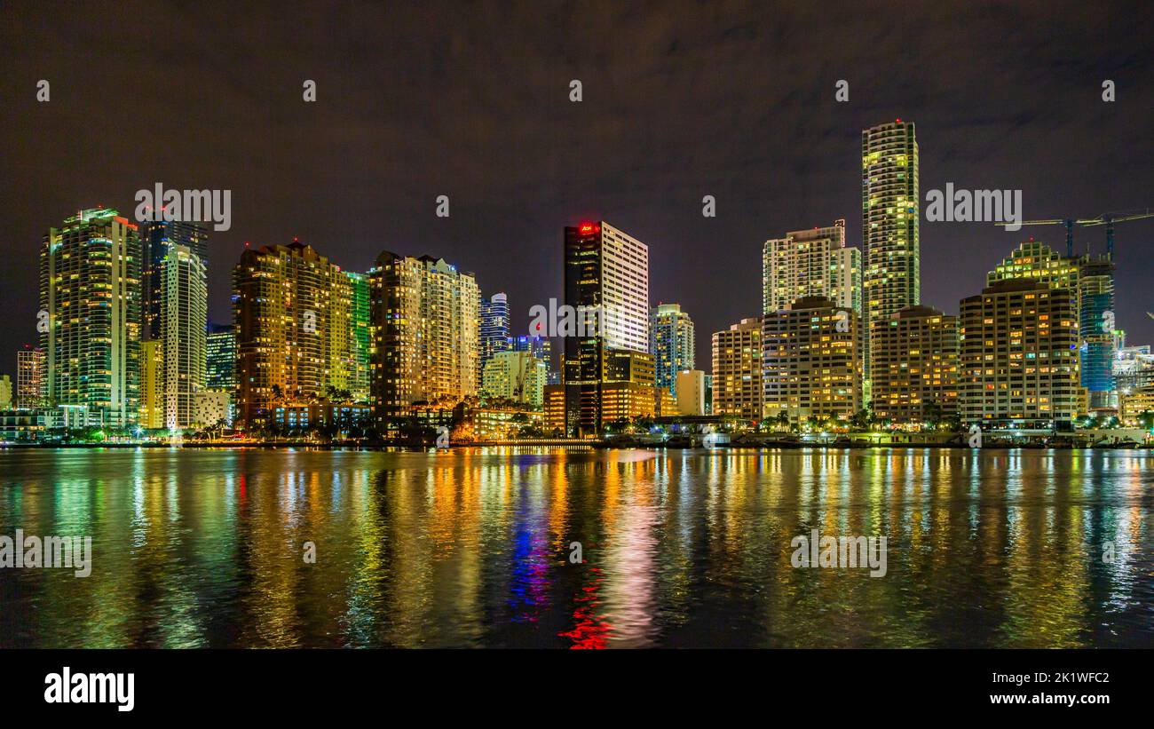 Buildings of the city skyline reflected in the intracoastal waterway at ...