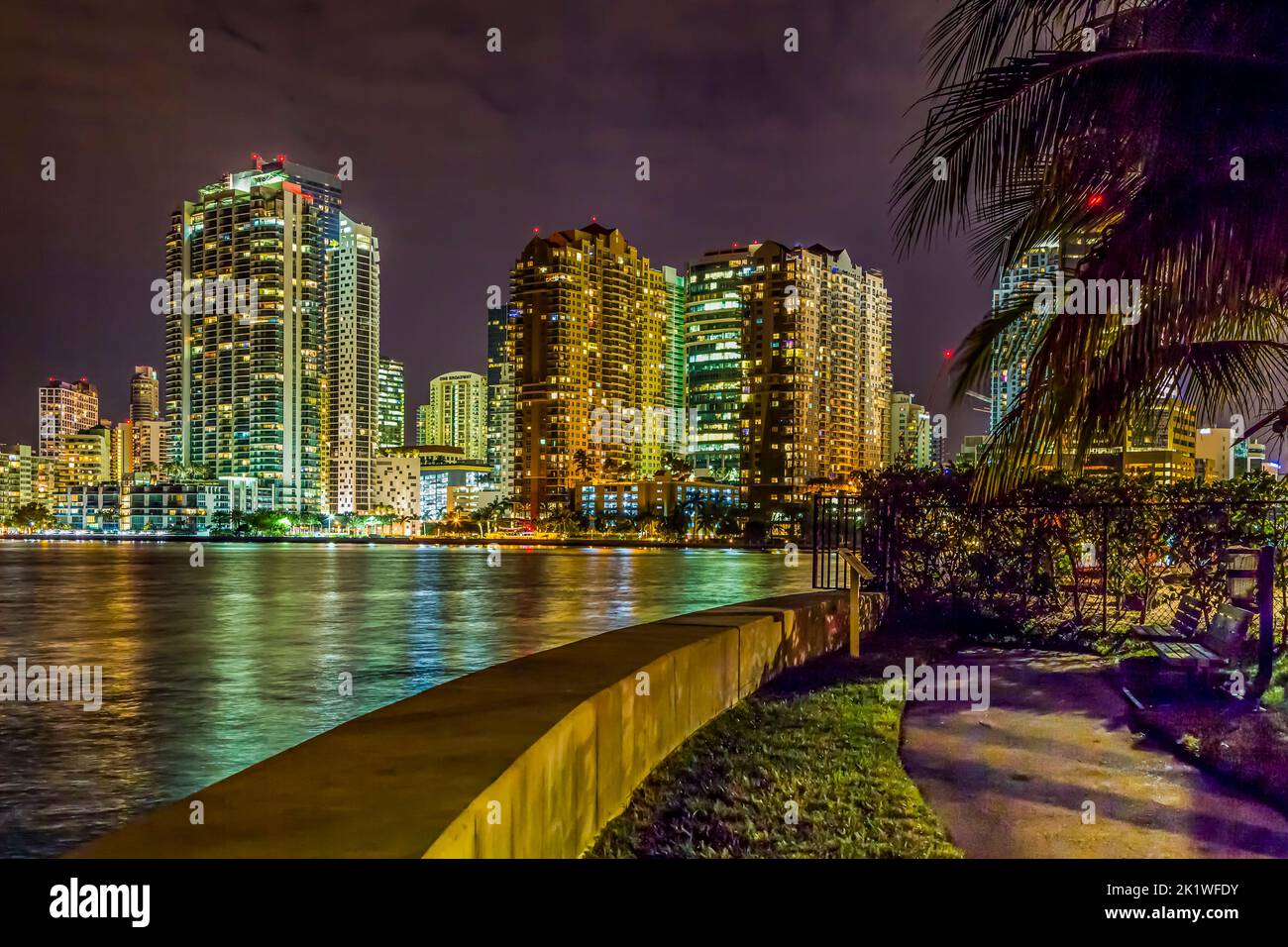 Buildings of the city skyline reflected in the intracoastal waterway at ...