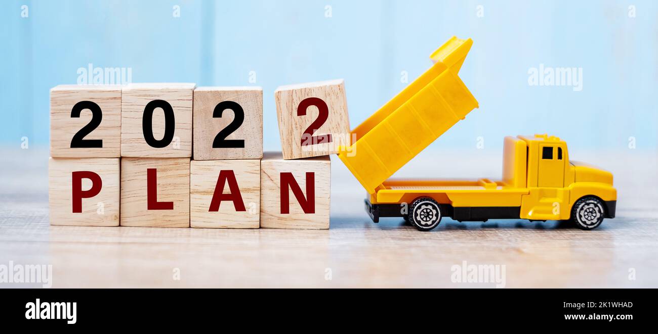 2022 Plan cube blocks with miniature truck or construction vehicle. New ...