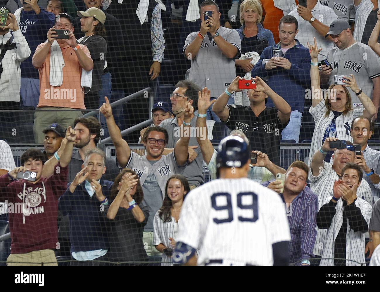 The crowd cheers after New York Yankees Aaron Judge hit his 60th home run of the season against ...