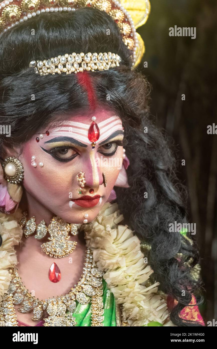 Concept Agomoni shoot with black haired Indian brunette woman face with perfect makeup and ...