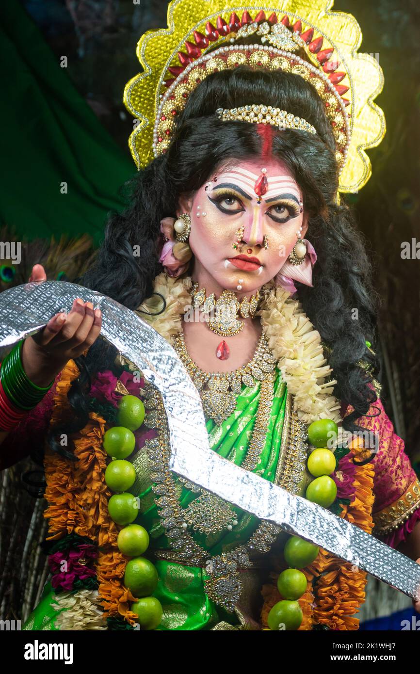 Concept Agomoni shoot with black haired Indian brunette woman face with ...