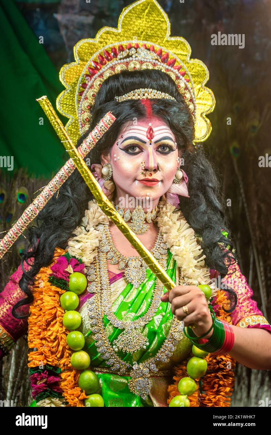 Concept Agomoni shoot with black haired Indian brunette woman face with ...