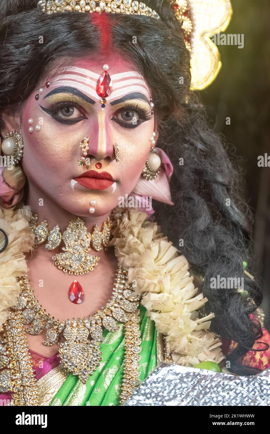 Concept Agomoni shoot with black haired Indian brunette woman face with ...