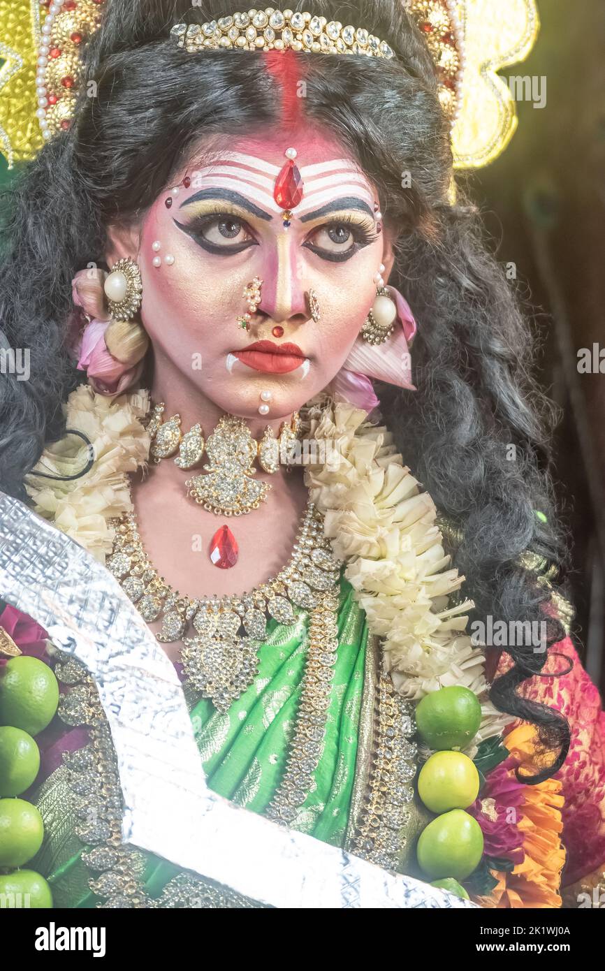 Concept Agomoni shoot with black haired Indian brunette woman face with ...