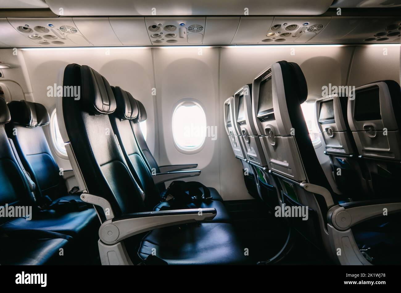 A Empty airplane seats seen from inside with window and copyspace Stock ...