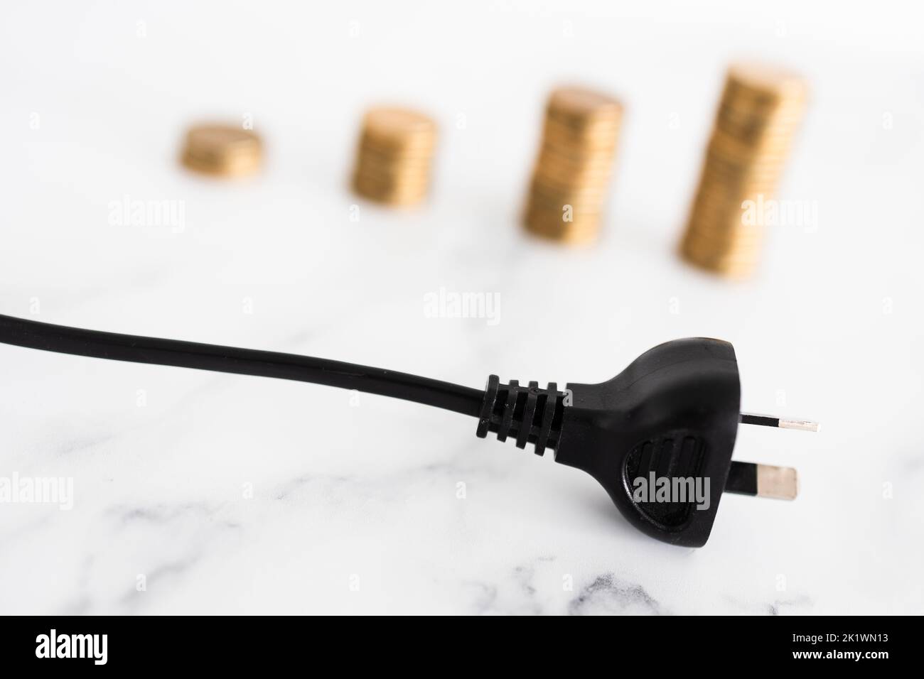 electricity costs going up conceptual image, plug with growing stacks ...
