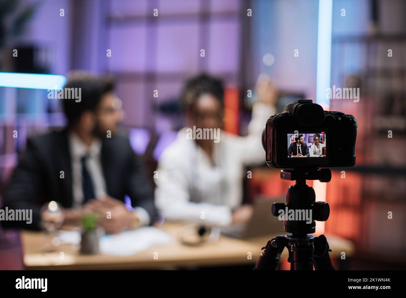 View from screen of camera with attractive male and female financiers ...