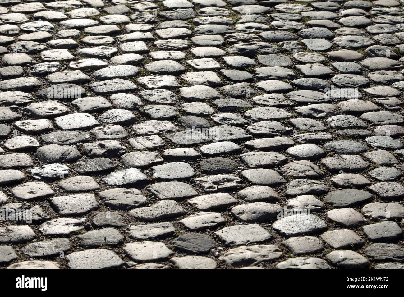 background of road pavement made with many smooth pebbles without ...