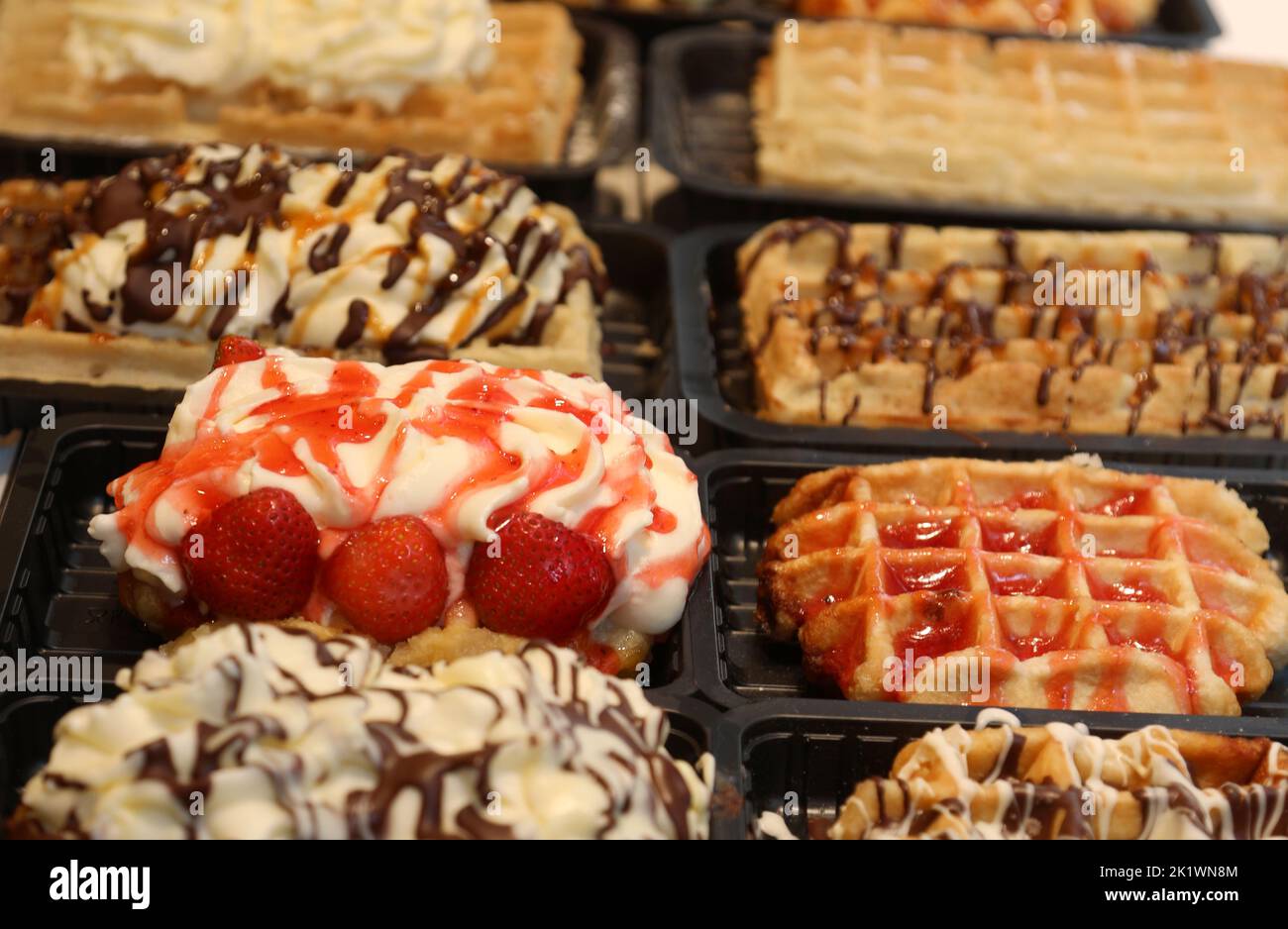 waffle typical dessert of Belgium with a sweet strawberry and cream ...