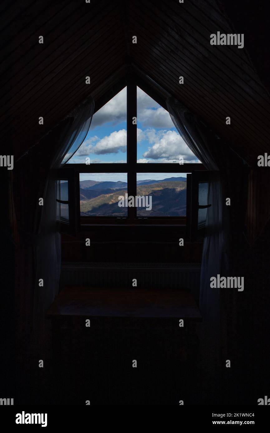 Wooden house inside with big opened windows. Beautiful view on ...