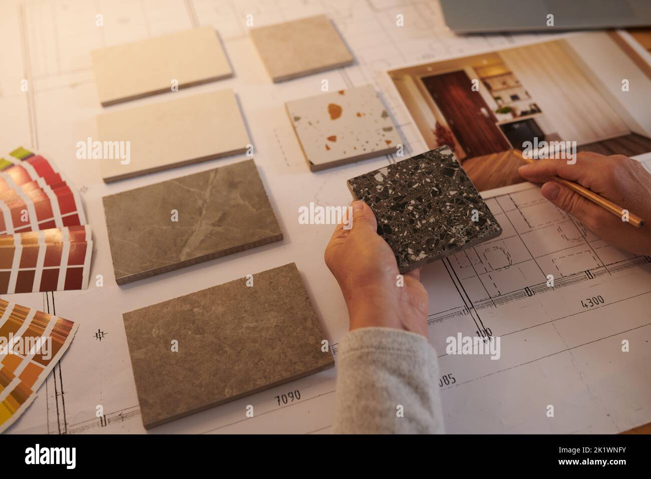 Interior designer choosing samples of floor tiles for project Stock ...