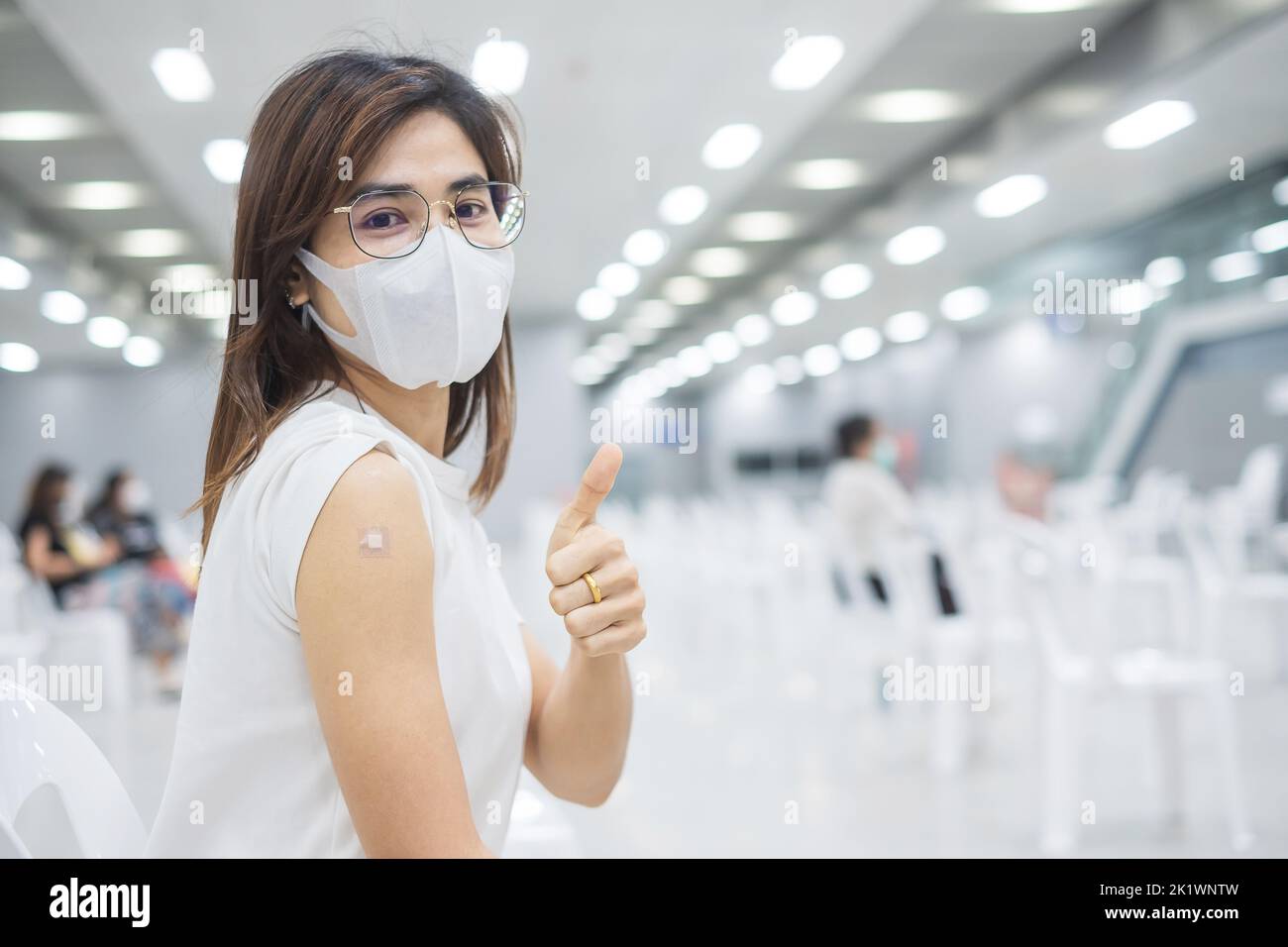 Happy woman showing thumb after receiving vaccine. Vaccination ...