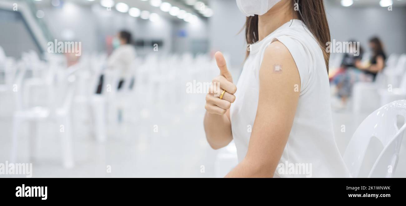 Happy woman showing thumb after receiving vaccine. Vaccination ...
