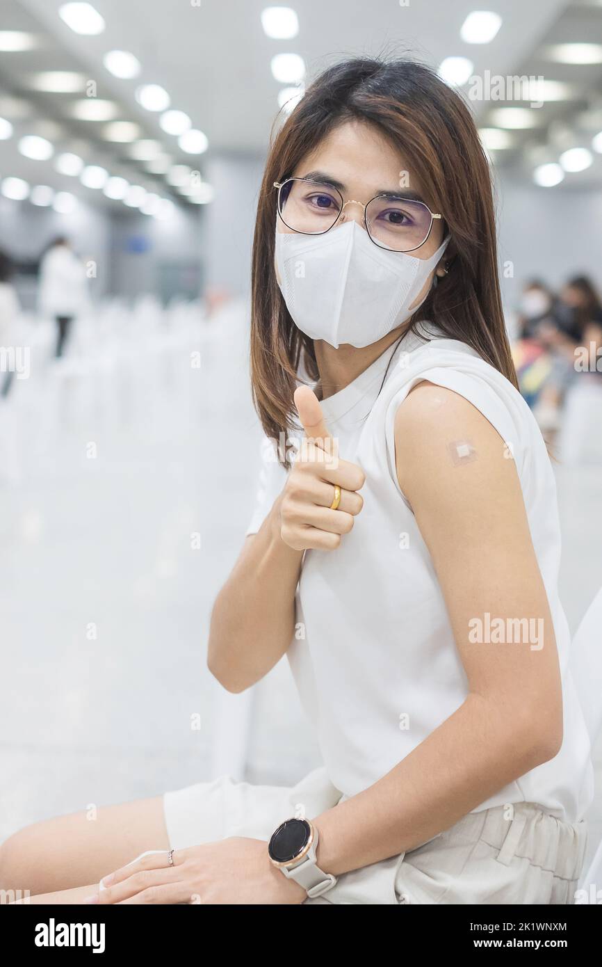 Happy woman showing thumb after receiving vaccine. Vaccination ...