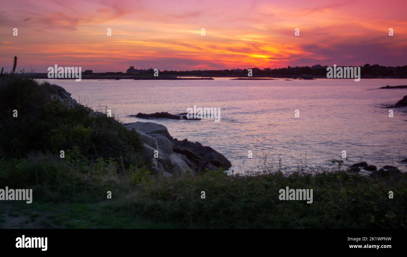 A scenic sunset over the sea, southern point of Newport, Rhode Island ...