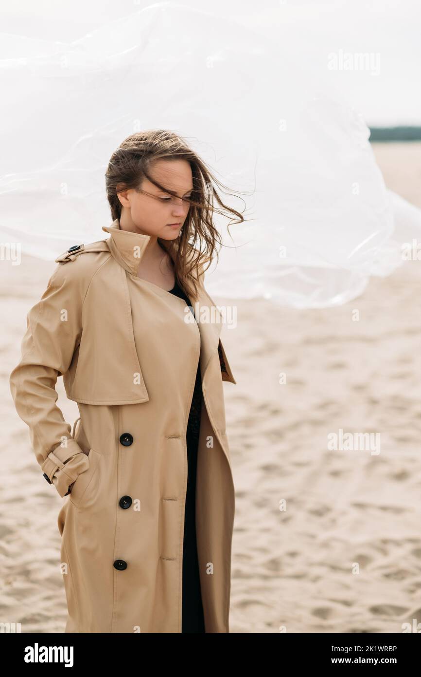 Female trench coat wind hi-res stock photography and images - Alamy