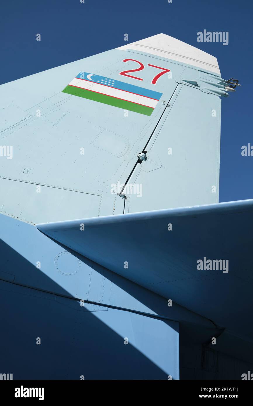 Tail detail of a restored blue and white Uzbek Air Force Sukhoi Su-27 ...