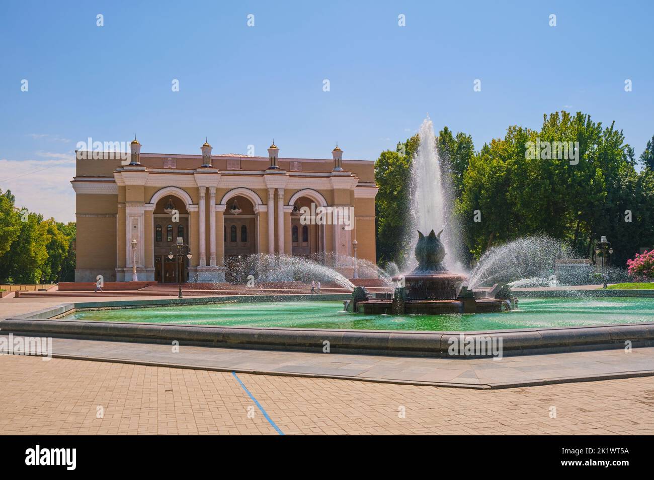 The front facade of the Alisher Navoi Theater with water fountain in ...