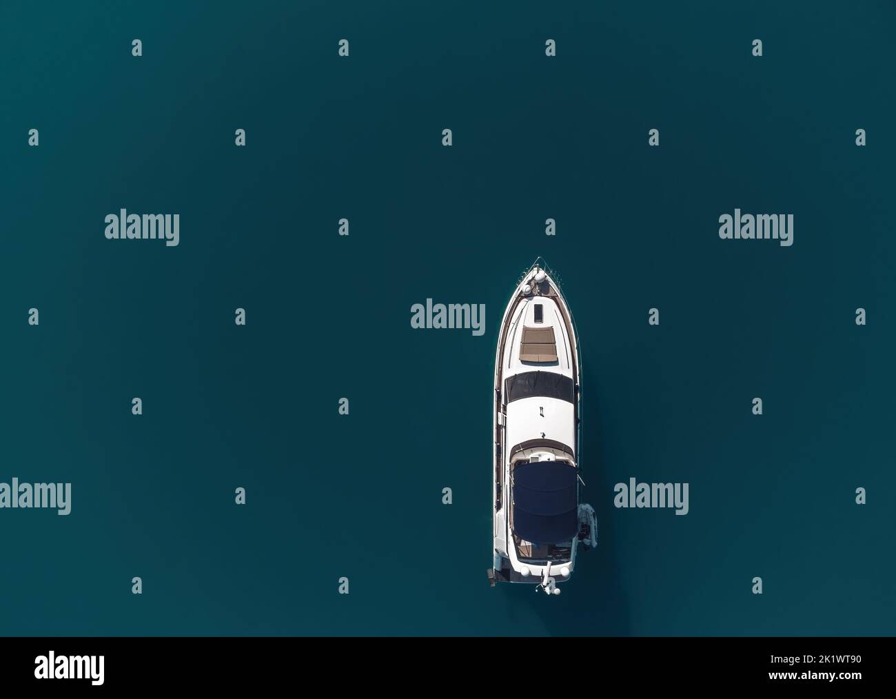 Aerial yacht on calm sea. Luxury cruise trip. View from above of white ...