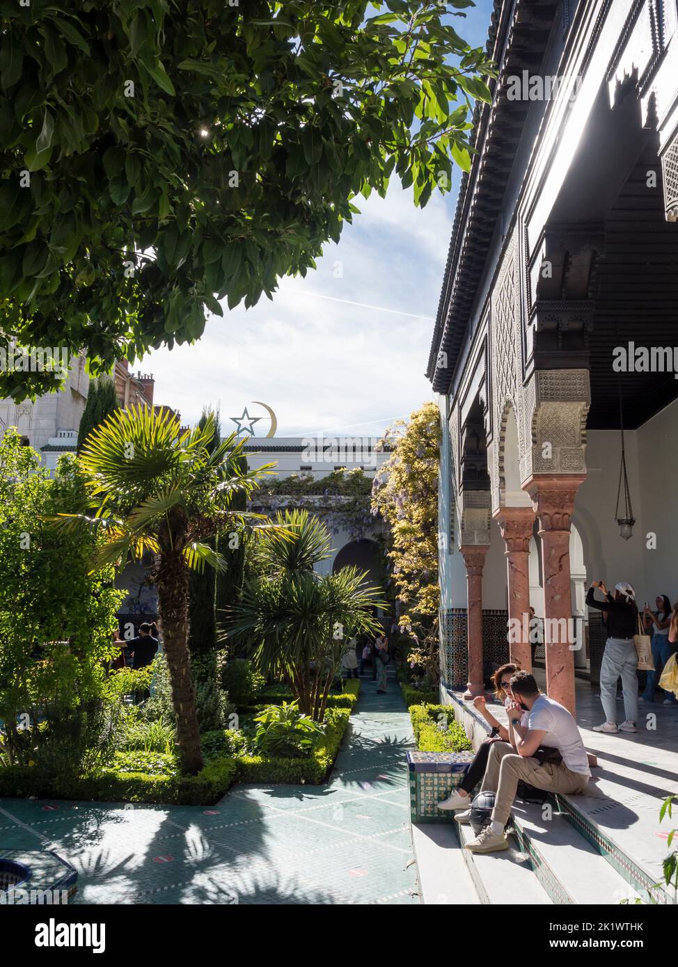 Tourists at the courtyard of the Grand Mosque of Paris, one of the ...