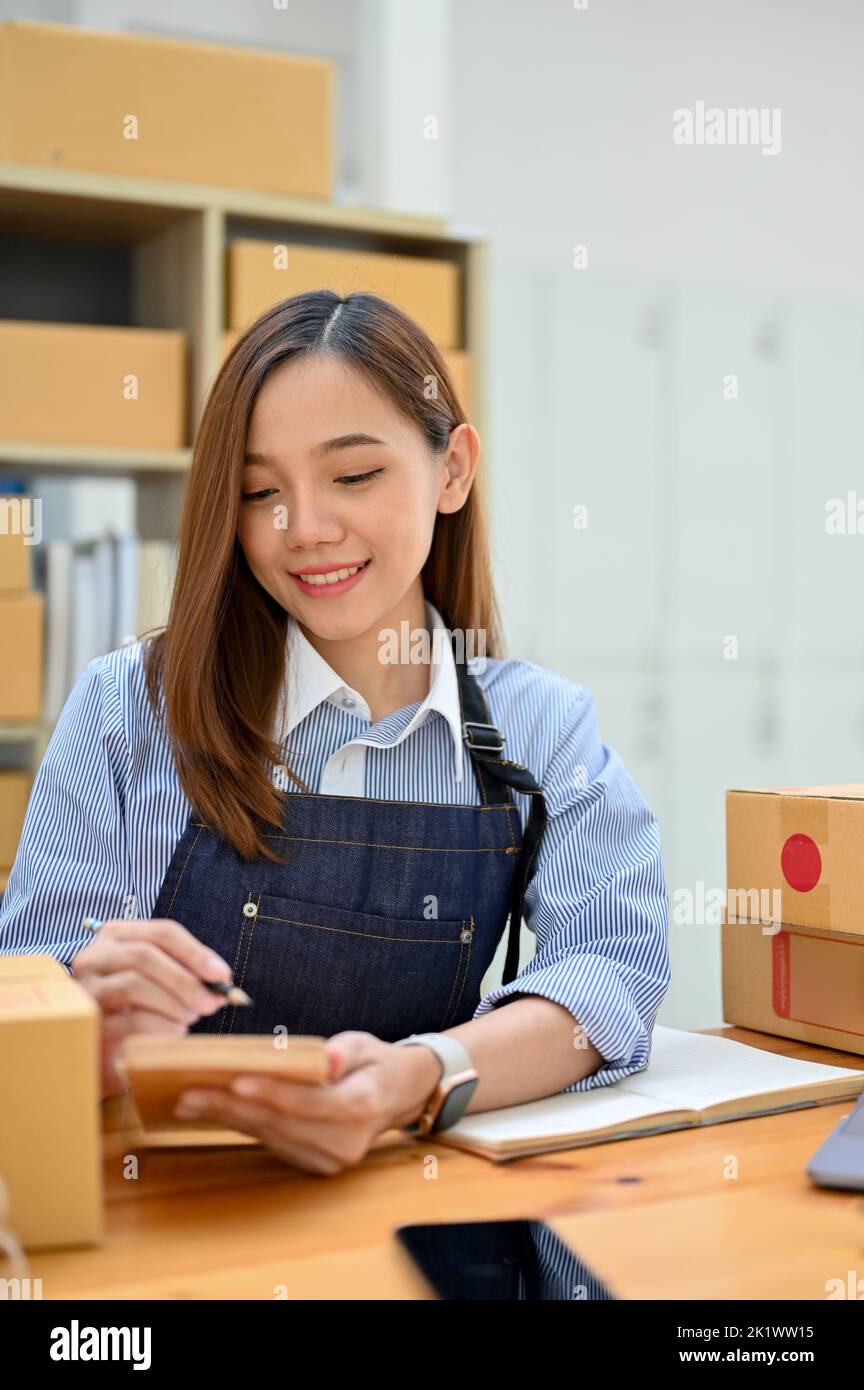 Portrait, Attractive millennial Asian female small online business ...