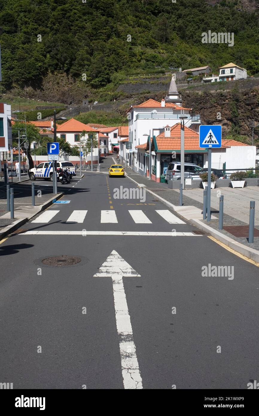 One way street in Sao Vicente with pedestrian crossing, parked police ...