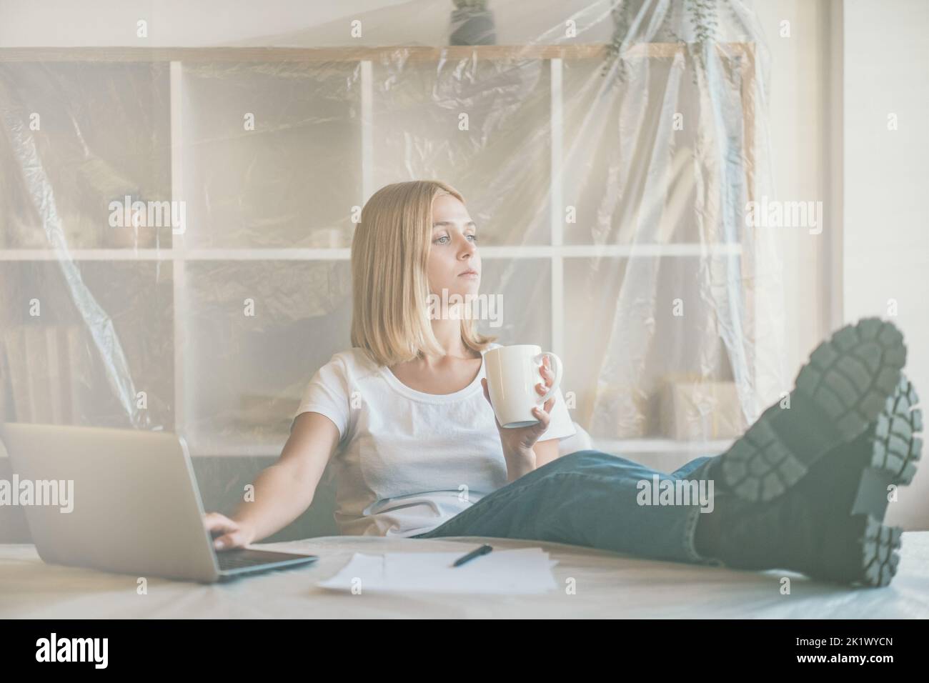 Home office. Freelance work. Creative job. Pensive hipster female ...