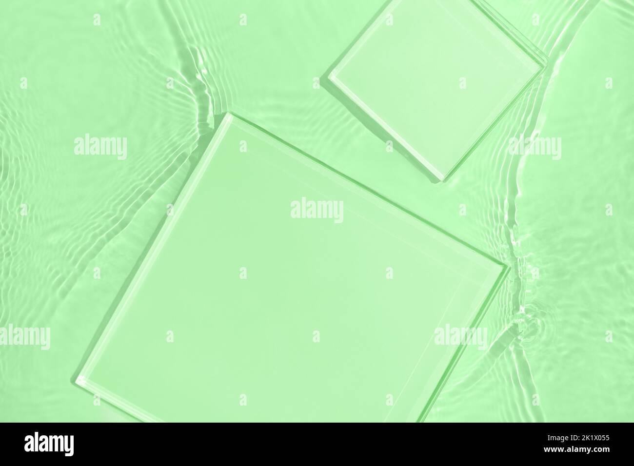 Two empty square podiums on transparent green water background Stock ...