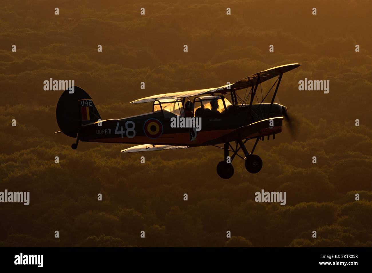 A Stampe-Vertongen SV.4 trainer biplane flying over Antwerp during a ...