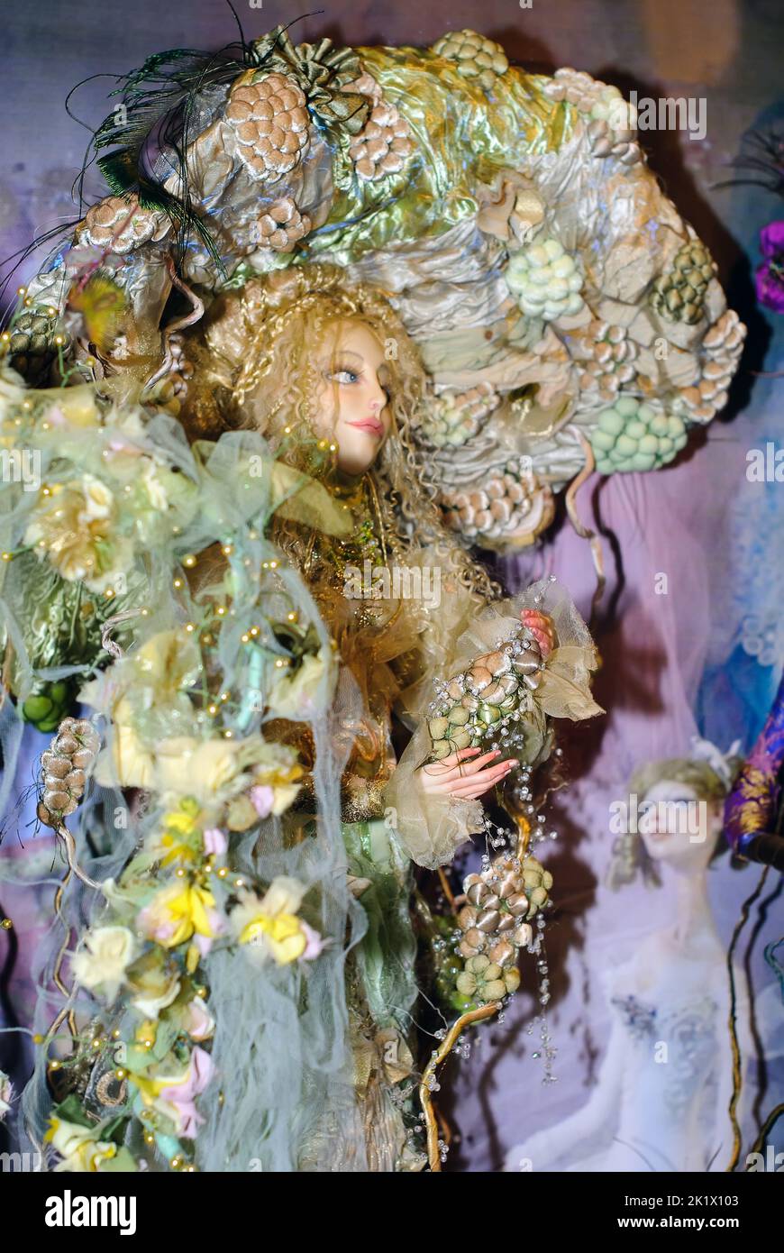 A collectible doll, a white grapefruit fairy detailed, is on display at ...